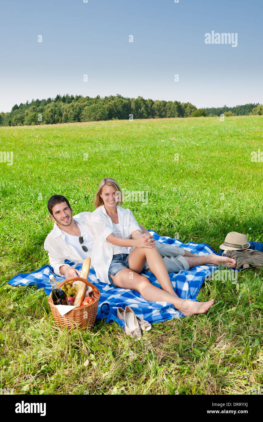 Picnic - Romantic couple in sunny meadows Stock Photo - Alamy
