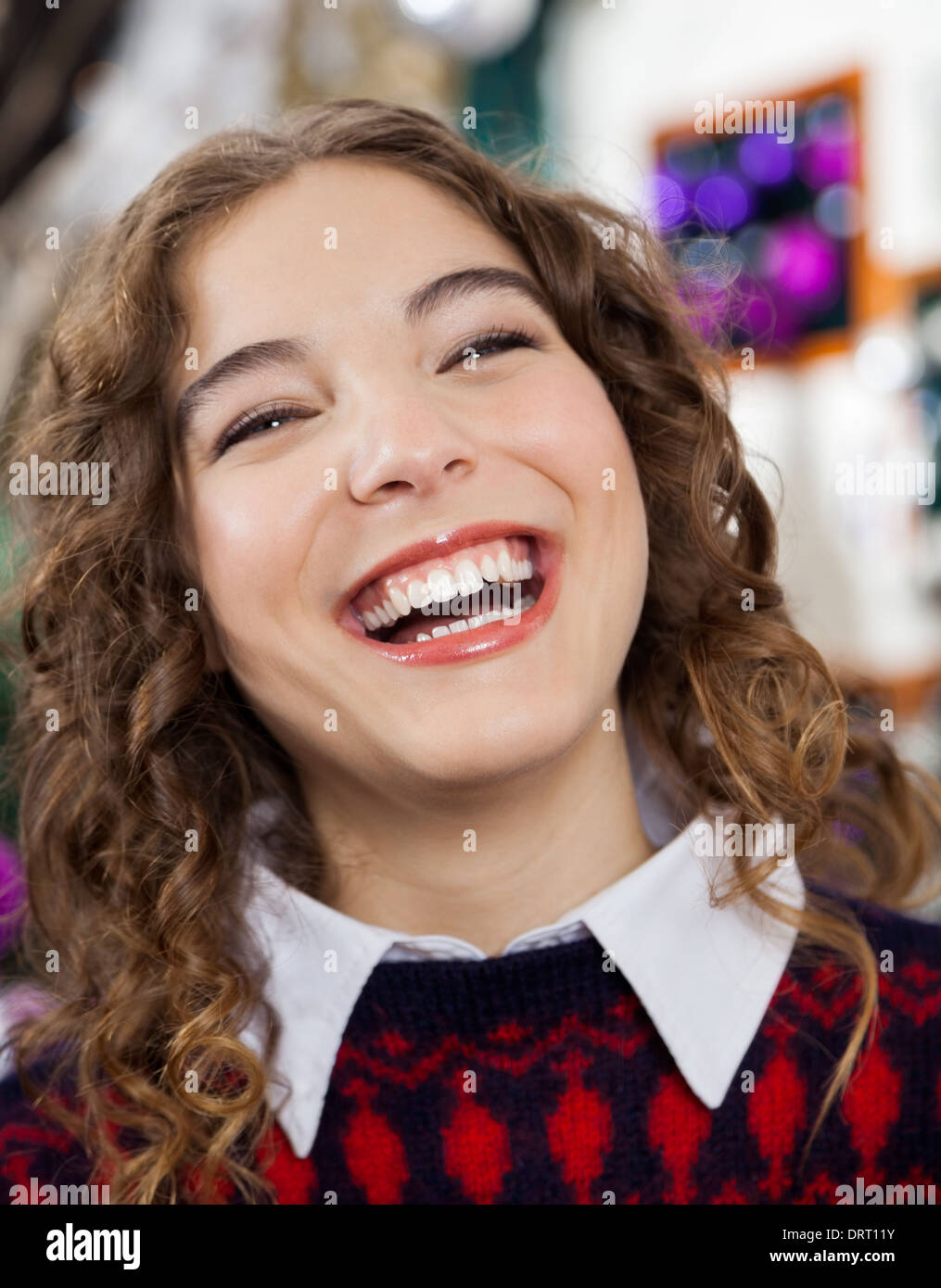 Woman Laughing In Christmas Store Stock Photo - Alamy