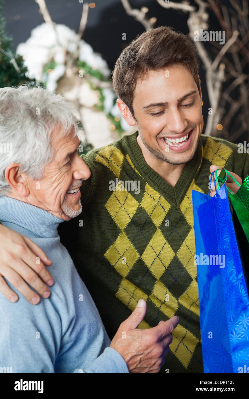 Happy Father And Son In Christmas Store Stock Photo - Alamy
