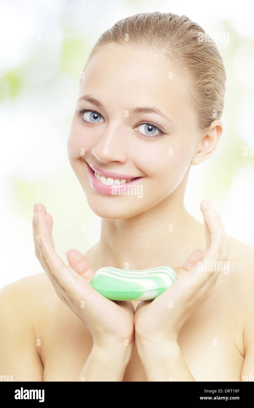Smiling girl holding soap Stock Photo - Alamy