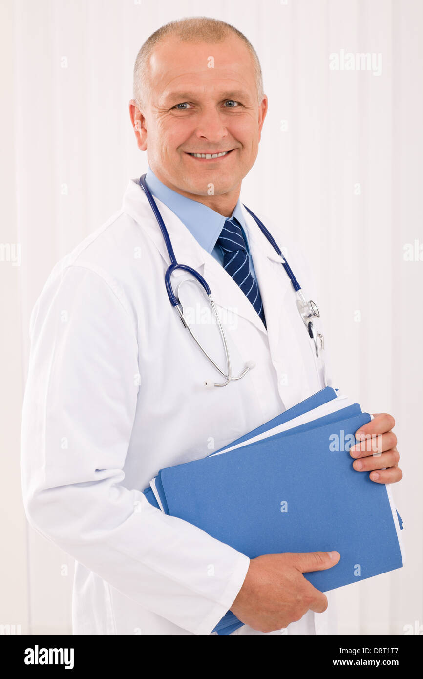 Mature doctor male portrait with folders Stock Photo - Alamy