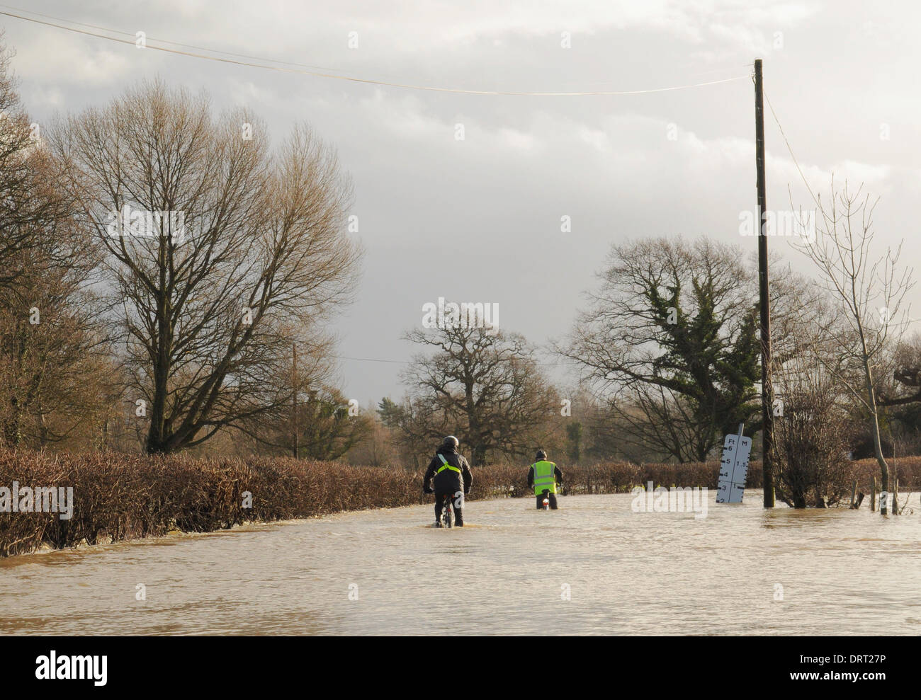 Barcombe, East Sussex, UK. 1st Feb, 2014. Cyclists brave the rising ...