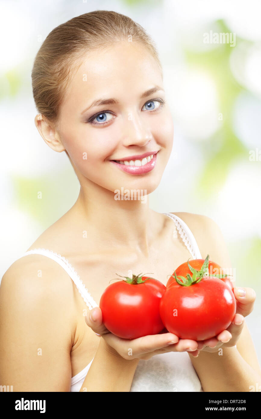 girl with three red tomatoes Stock Photo - Alamy