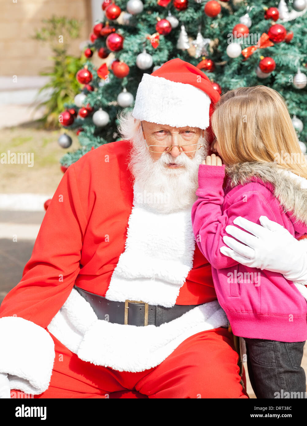 Child whispering santa claus hi-res stock photography and images - Alamy