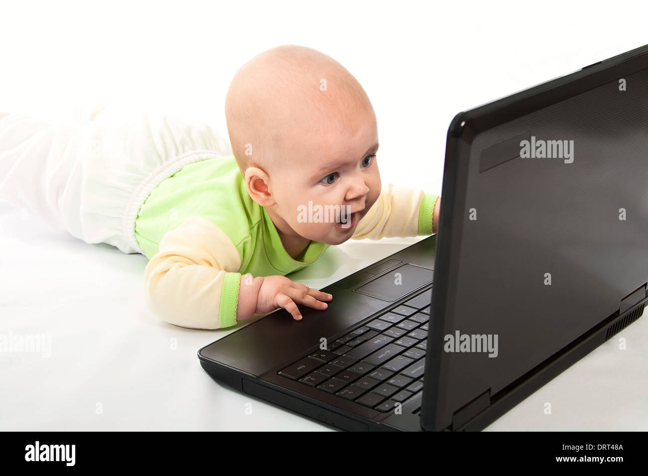 Little baby with laptop Stock Photo - Alamy