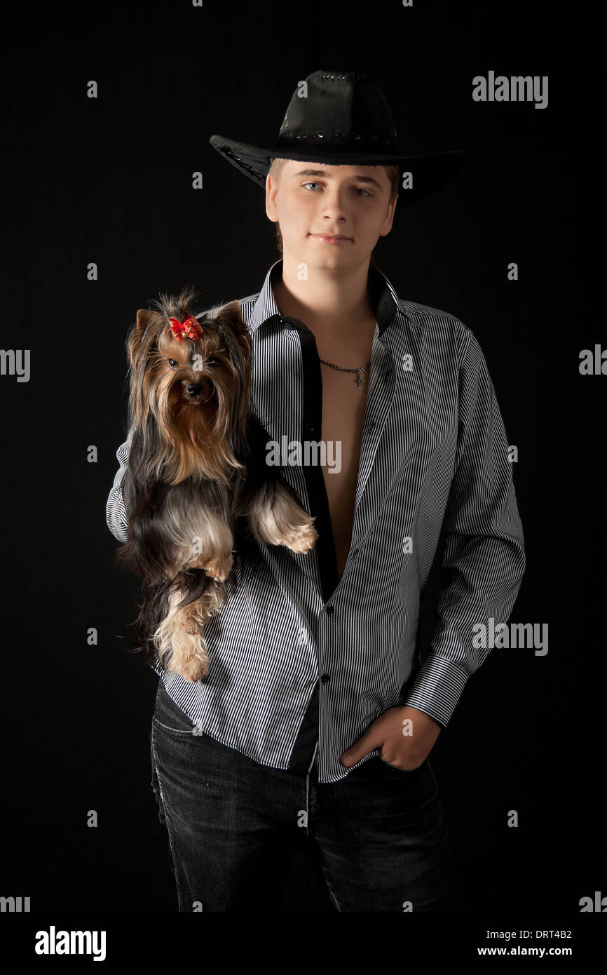 Young man with Yorkshire terrier Stock Photo - Alamy