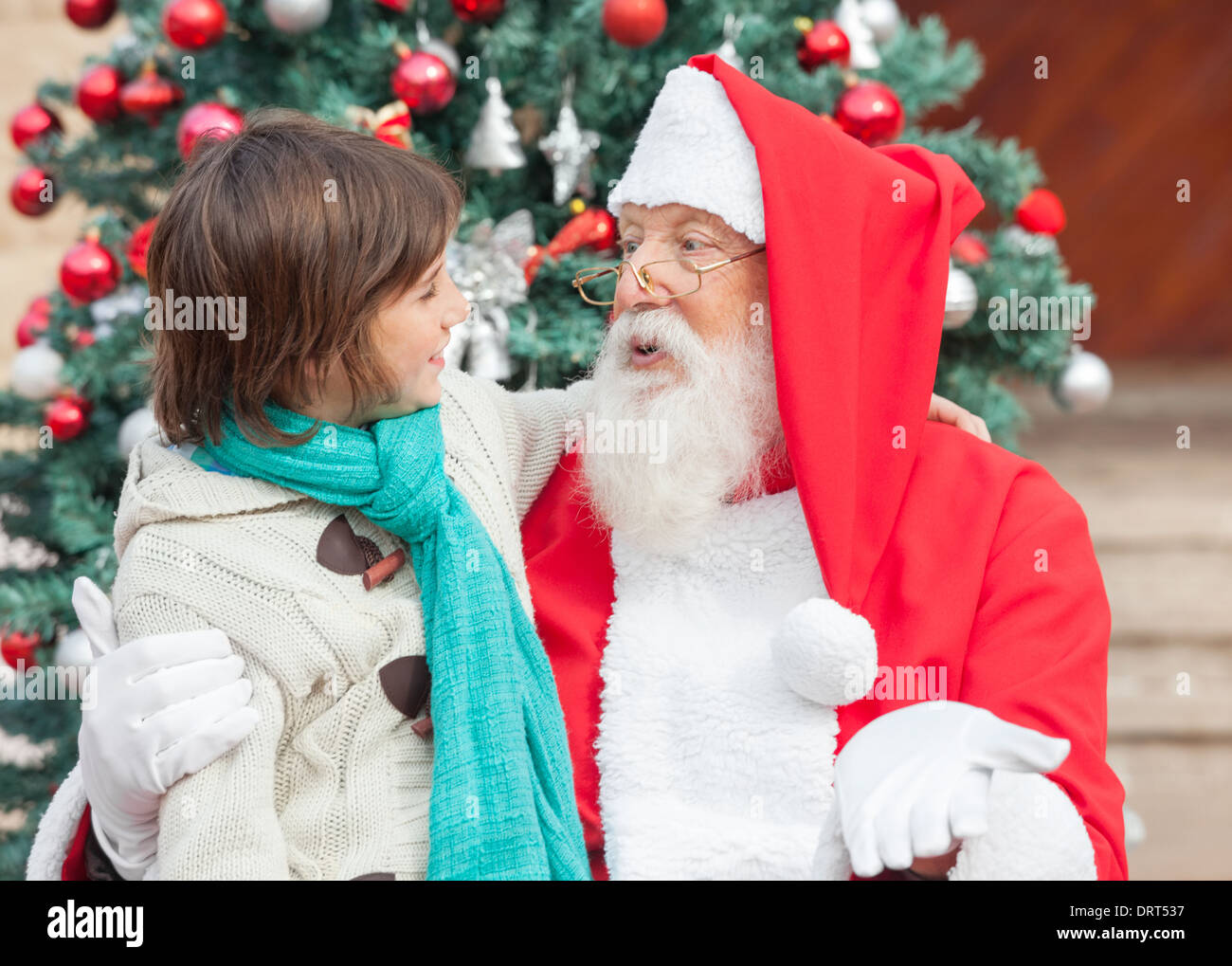 Boy And Santa Claus Looking At Each Other Stock Photo - Alamy
