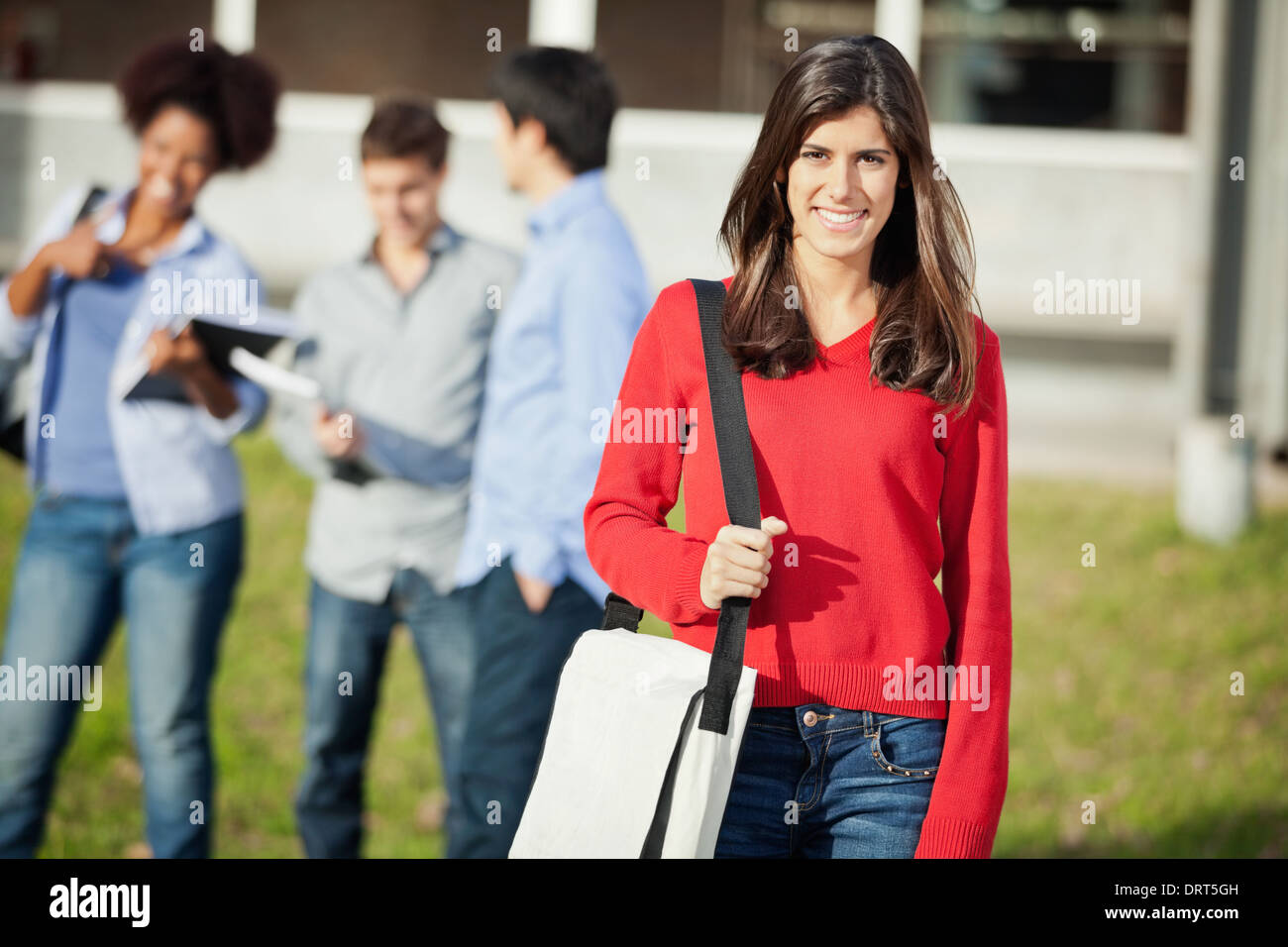 Student Carrying Shoulder Bag On University Campus Stock Photo - Alamy