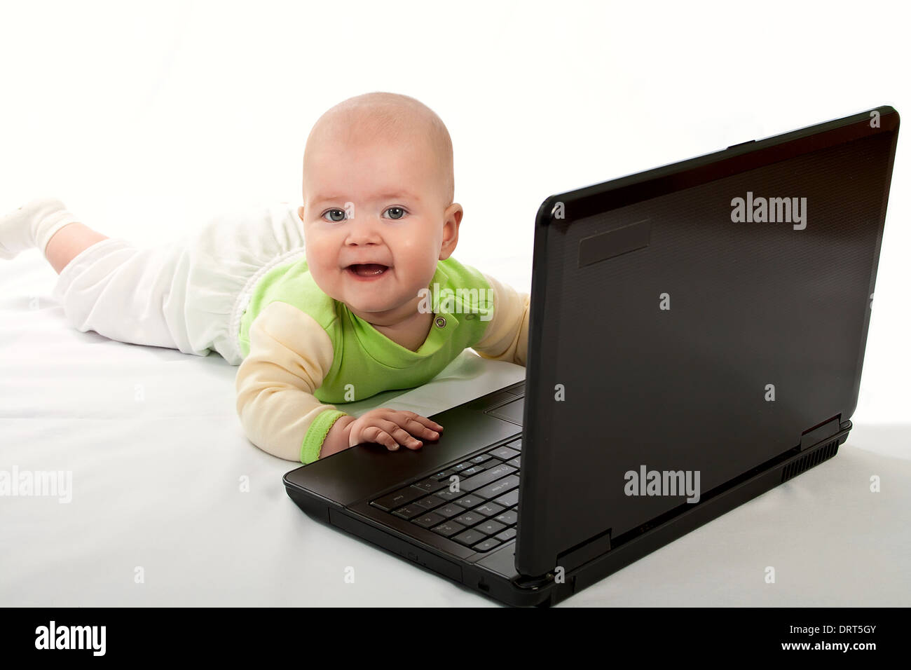 Little baby with laptop Stock Photo - Alamy