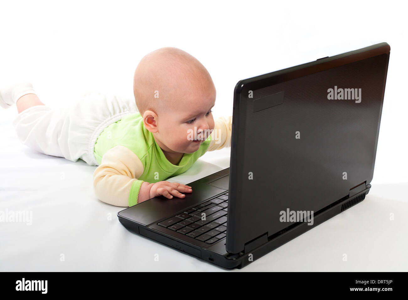 Little baby with laptop Stock Photo - Alamy