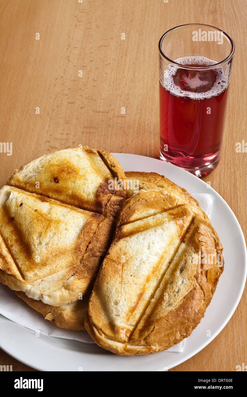 Toast sandwich made in a triangular press grilling Stock Photo - Alamy