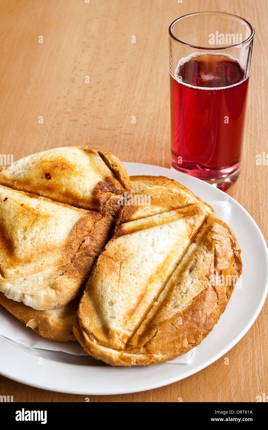 Toast sandwich made in a triangular press grilling Stock Photo - Alamy