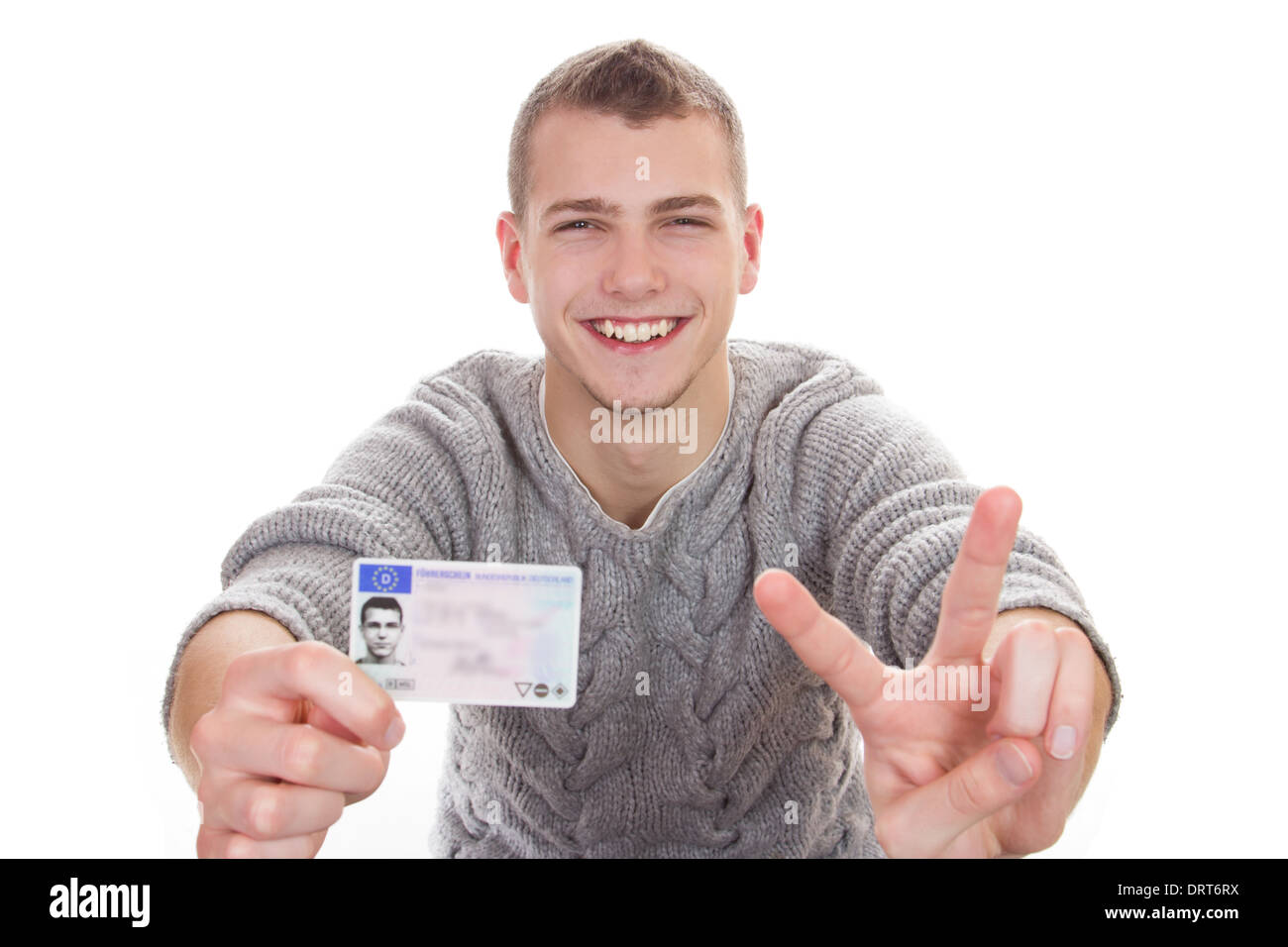 16 to 18 year old boy just received his driver license Stock Photo - Alamy
