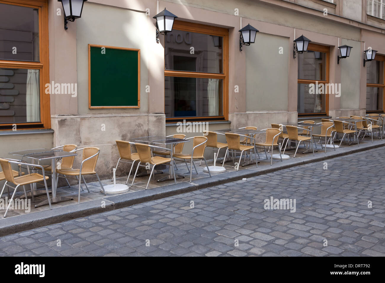 Tables and chairs in a cafe iv Vienna Stock Photo - Alamy