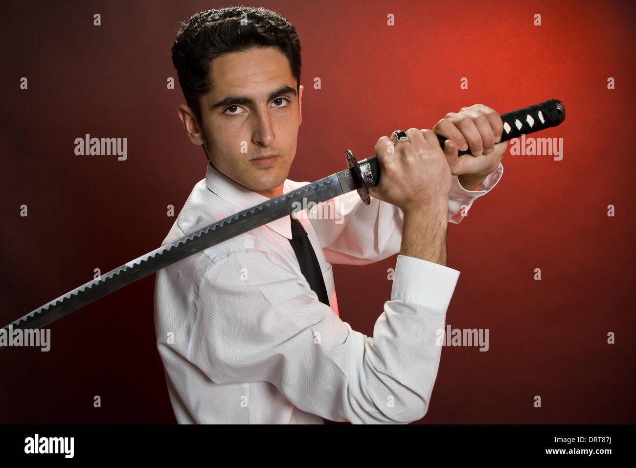 Handsome man with sword Stock Photo - Alamy
