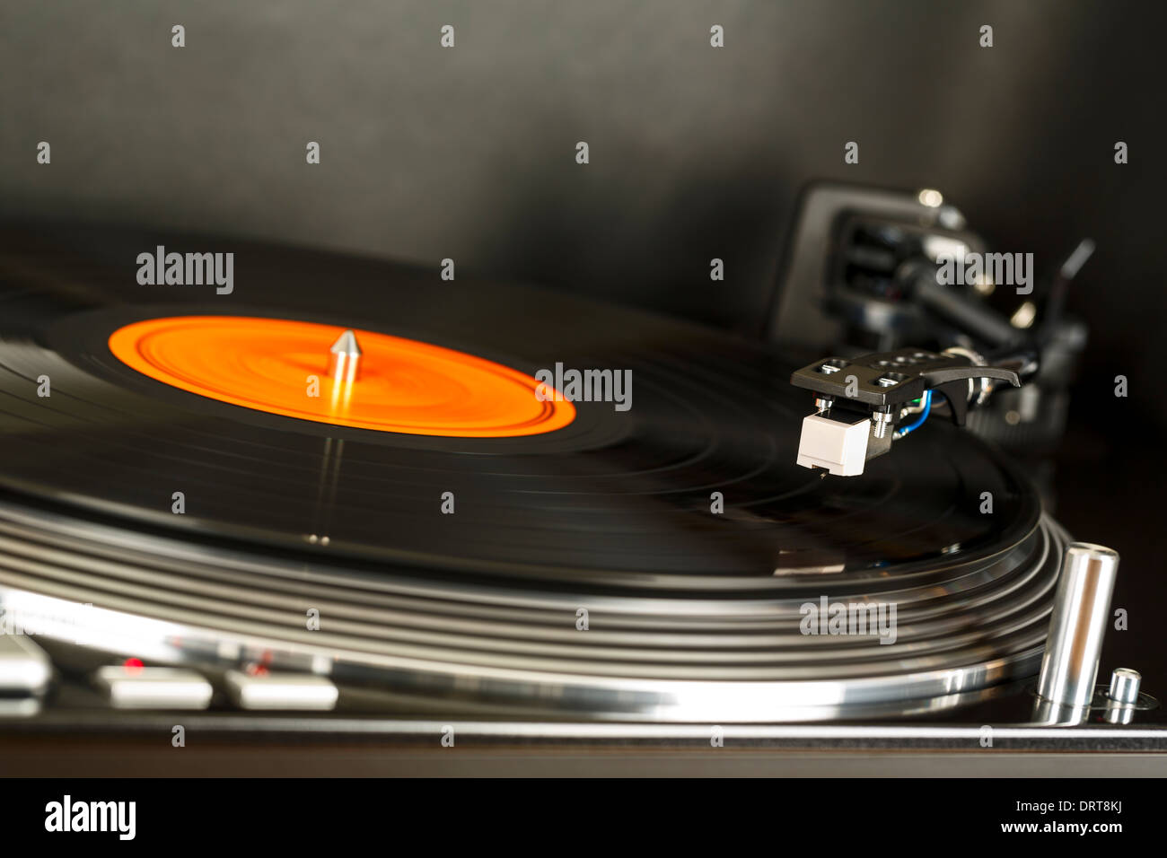 Turntable rotates together with vinyl record on Stock Photo - Alamy