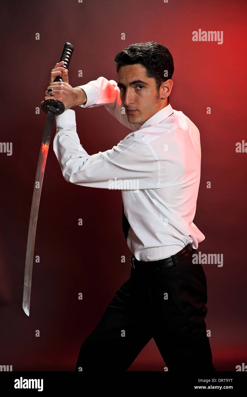 Handsome man with sword Stock Photo - Alamy
