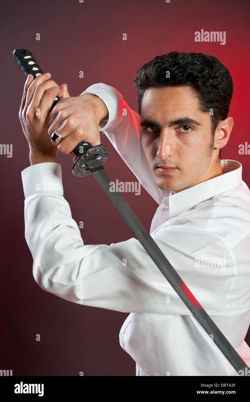 Handsome man with sword Stock Photo - Alamy