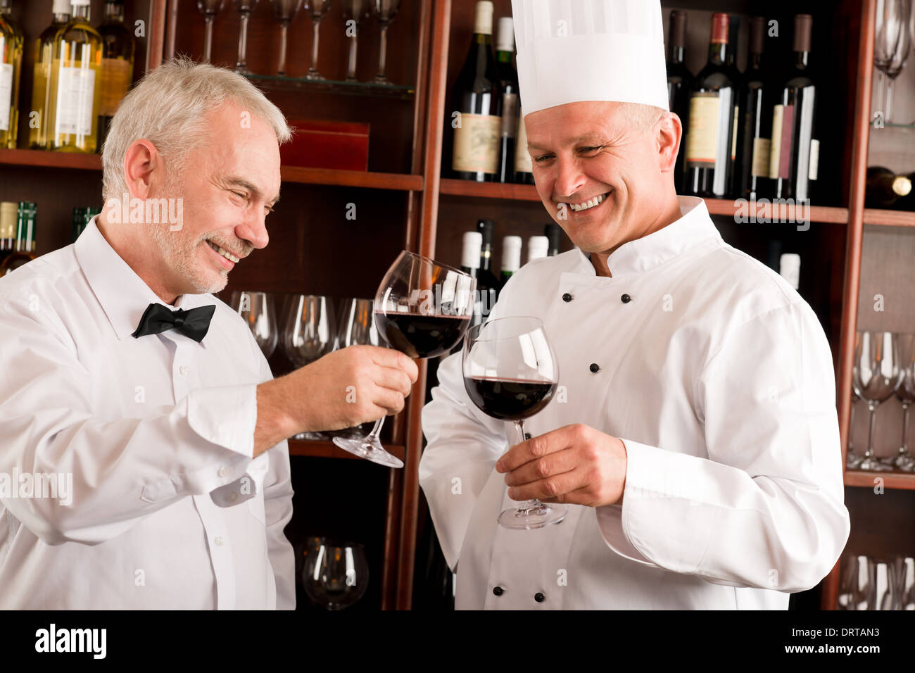 Chef cook and waiter wine tasting restaurant Stock Photo - Alamy
