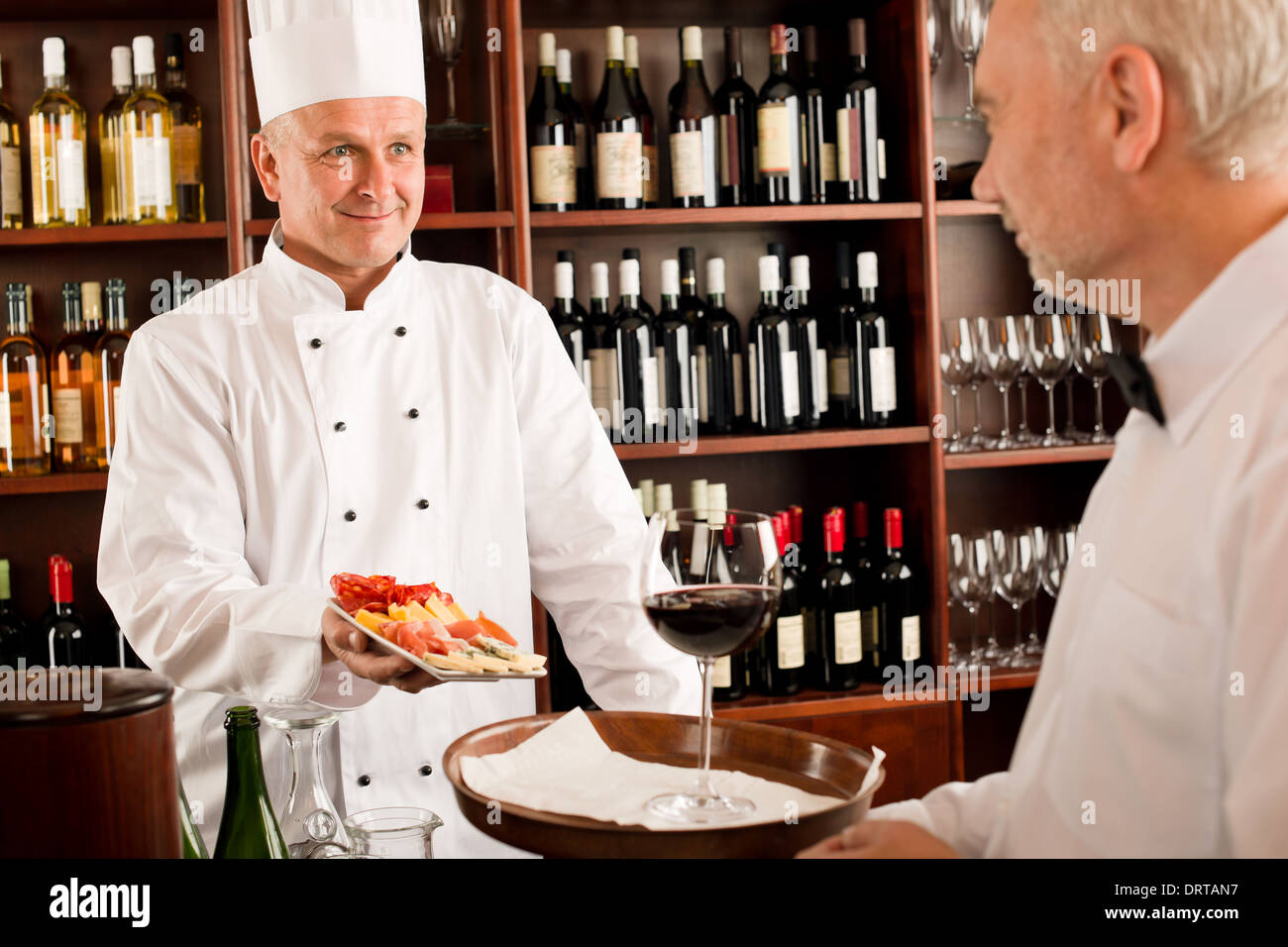 Chef cook with tapas on tray restaurant Stock Photo - Alamy