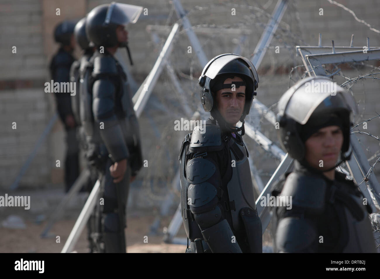 Cairo, Egypt. 1st Feb, 2014. Police stand guard outside the Police ...