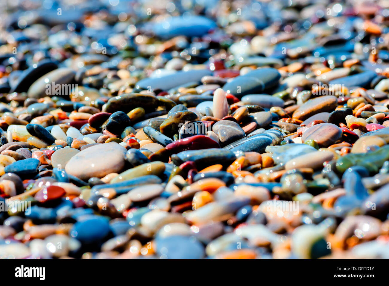colored pebbles on the beach Stock Photo - Alamy