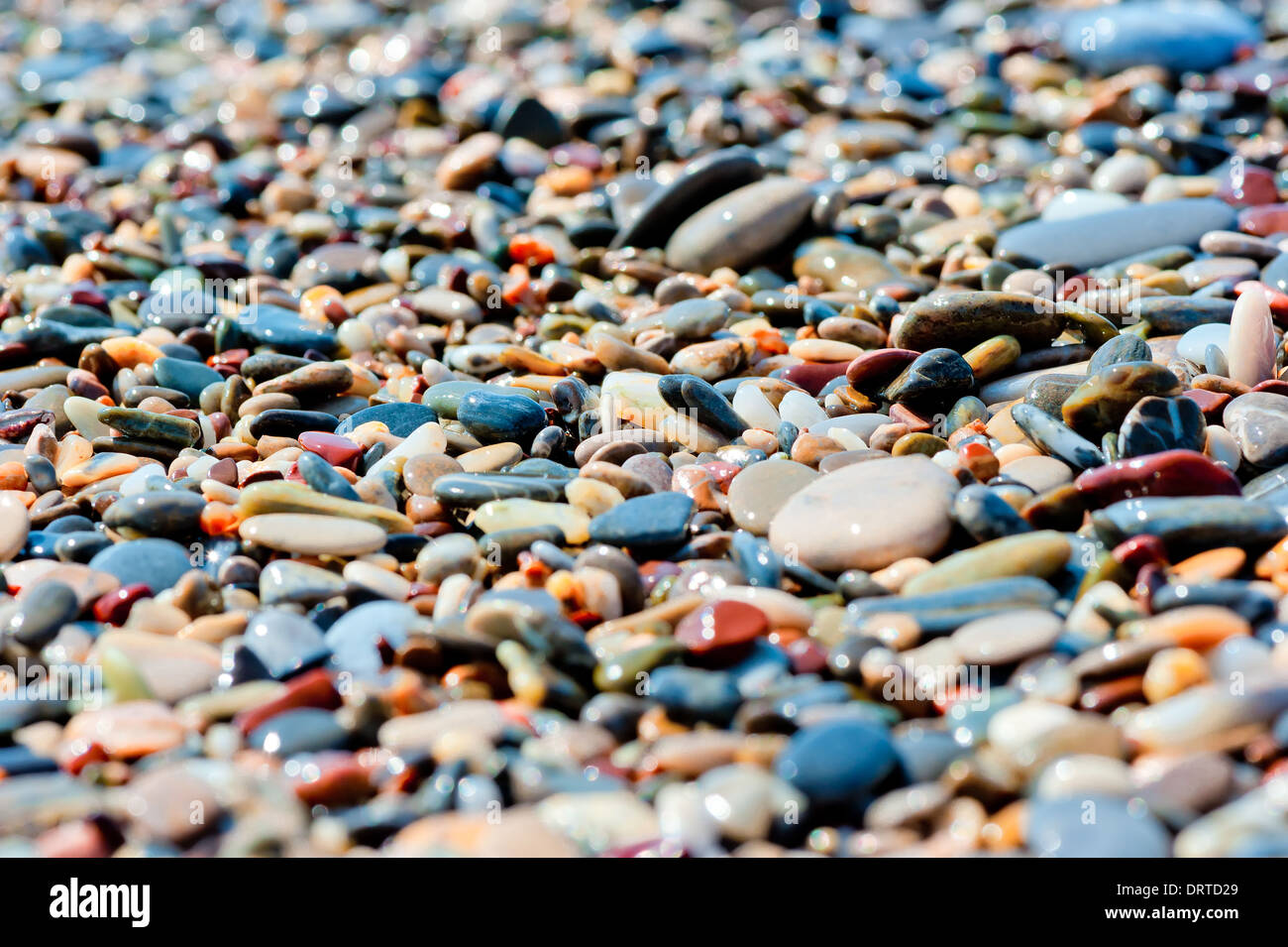 Shiny pebbles on beach hi-res stock photography and images - Alamy