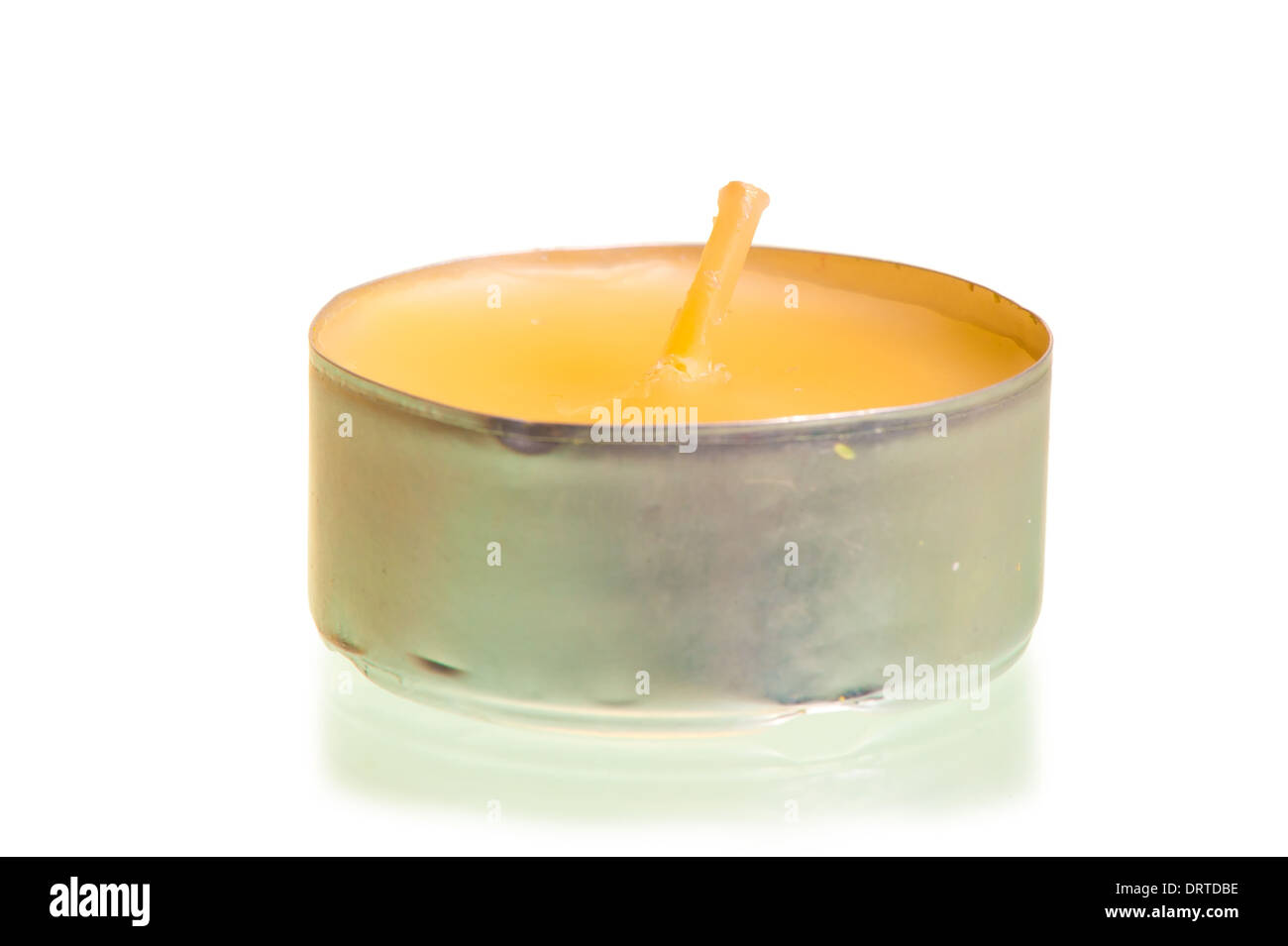 one small new candle on a white background Stock Photo - Alamy