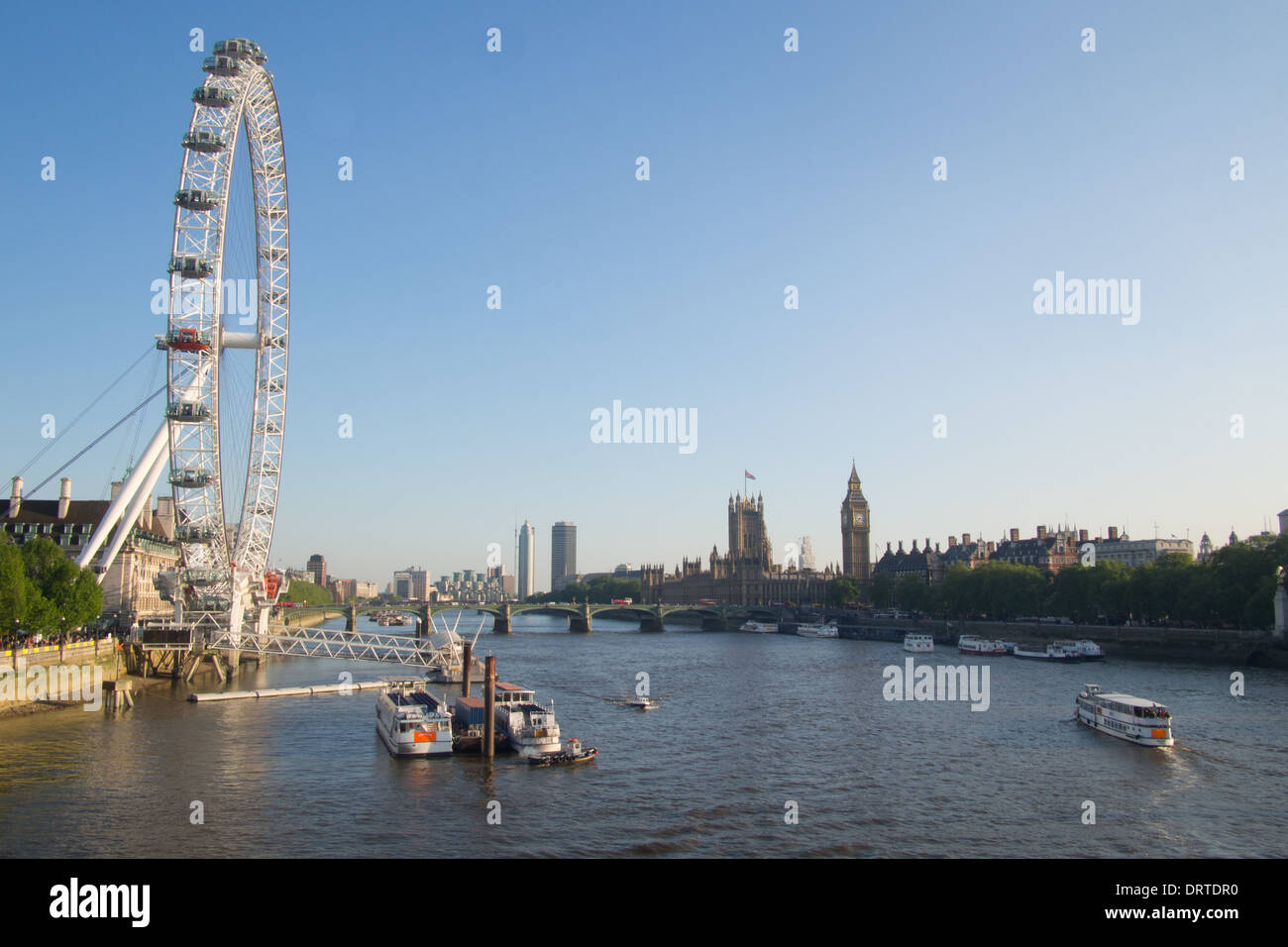 London Eye and The Houses of Parliament on the River Thames, London ...