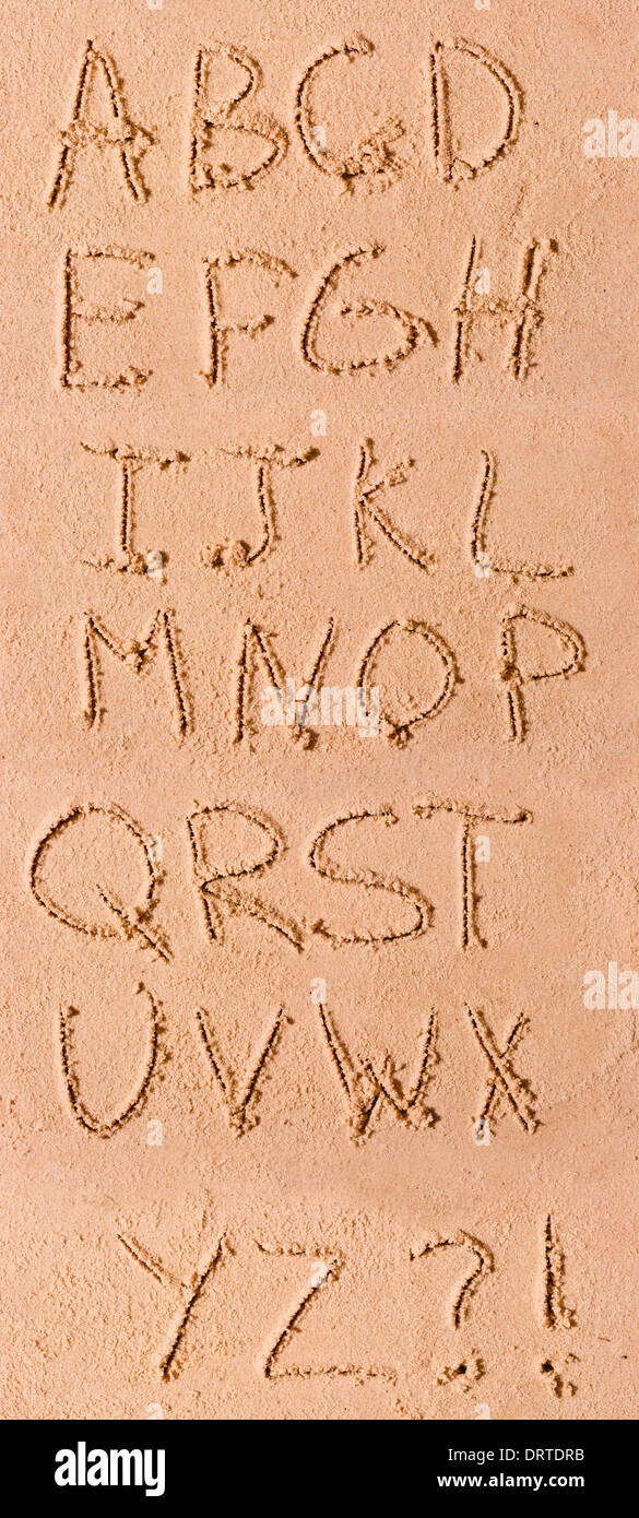Alphabet writing on sand letter hi-res stock photography and images - Alamy