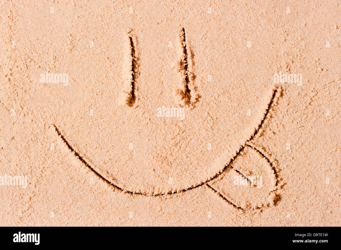 smiley face with a smile and his tongue hanging out Stock Photo - Alamy