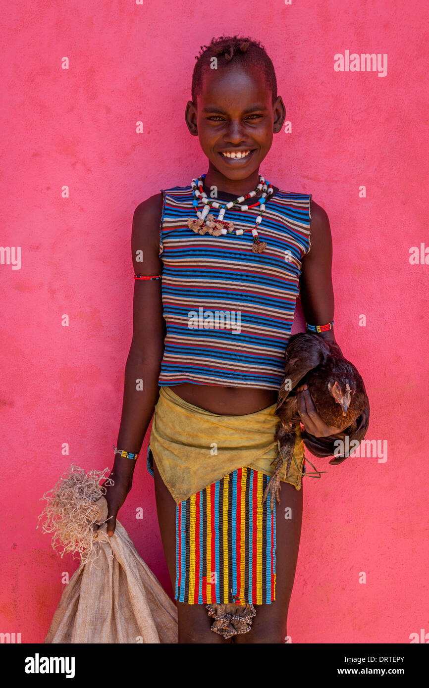 A Child From The Banna Tribe In Traditional Costume On Her Way To ...