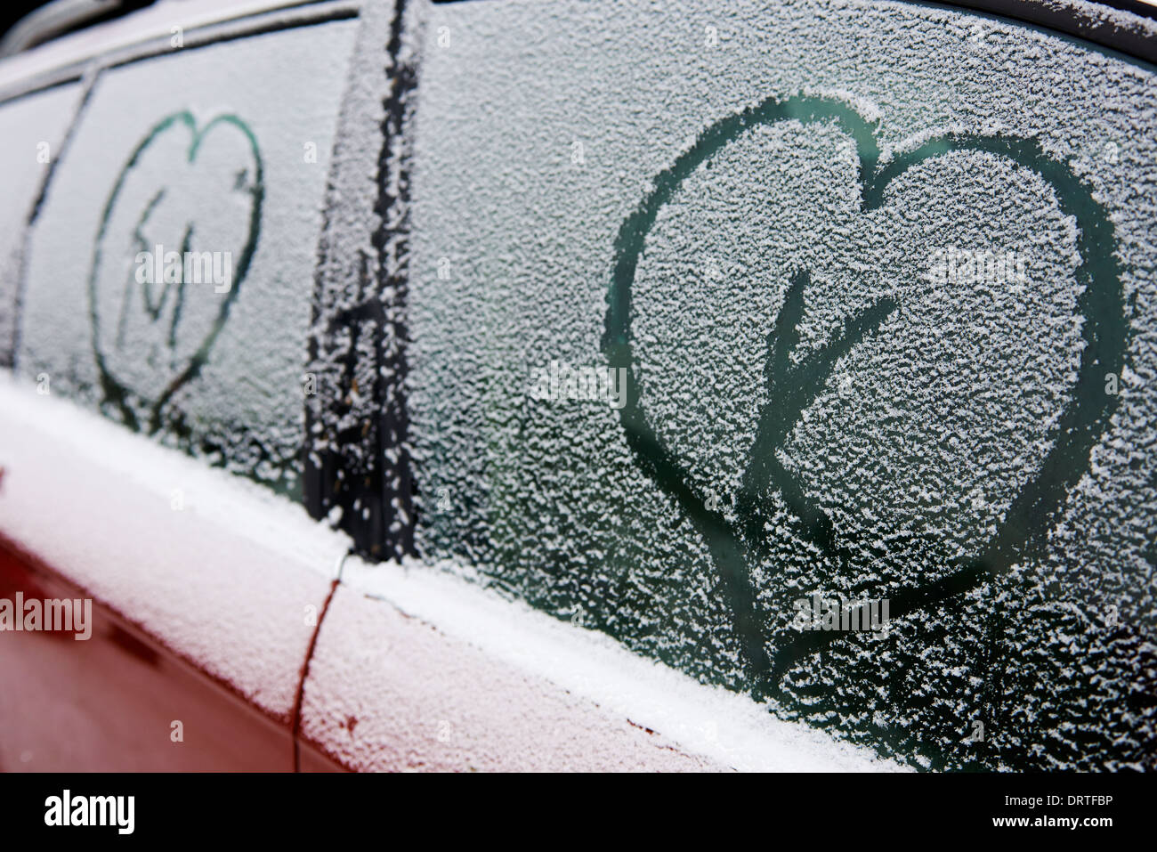 heart shape in snow on the windshield of a vehicle - car. Sign of love ...