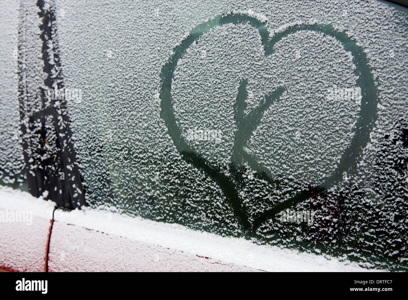 heart shape in snow on the windshield of a vehicle - car. Sign of love ...