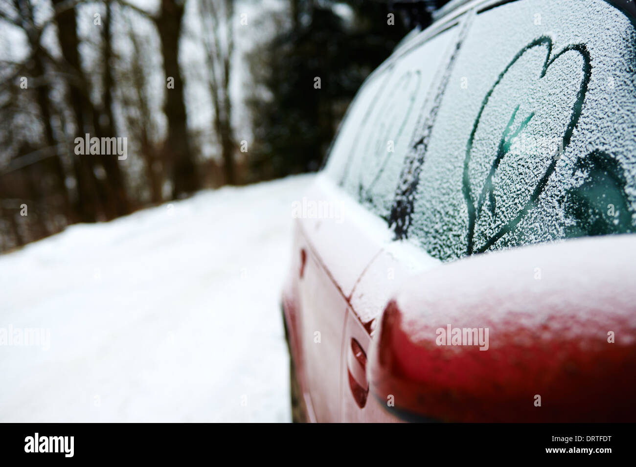 heart shape in snow on the windshield of a vehicle - car. Sign of love ...