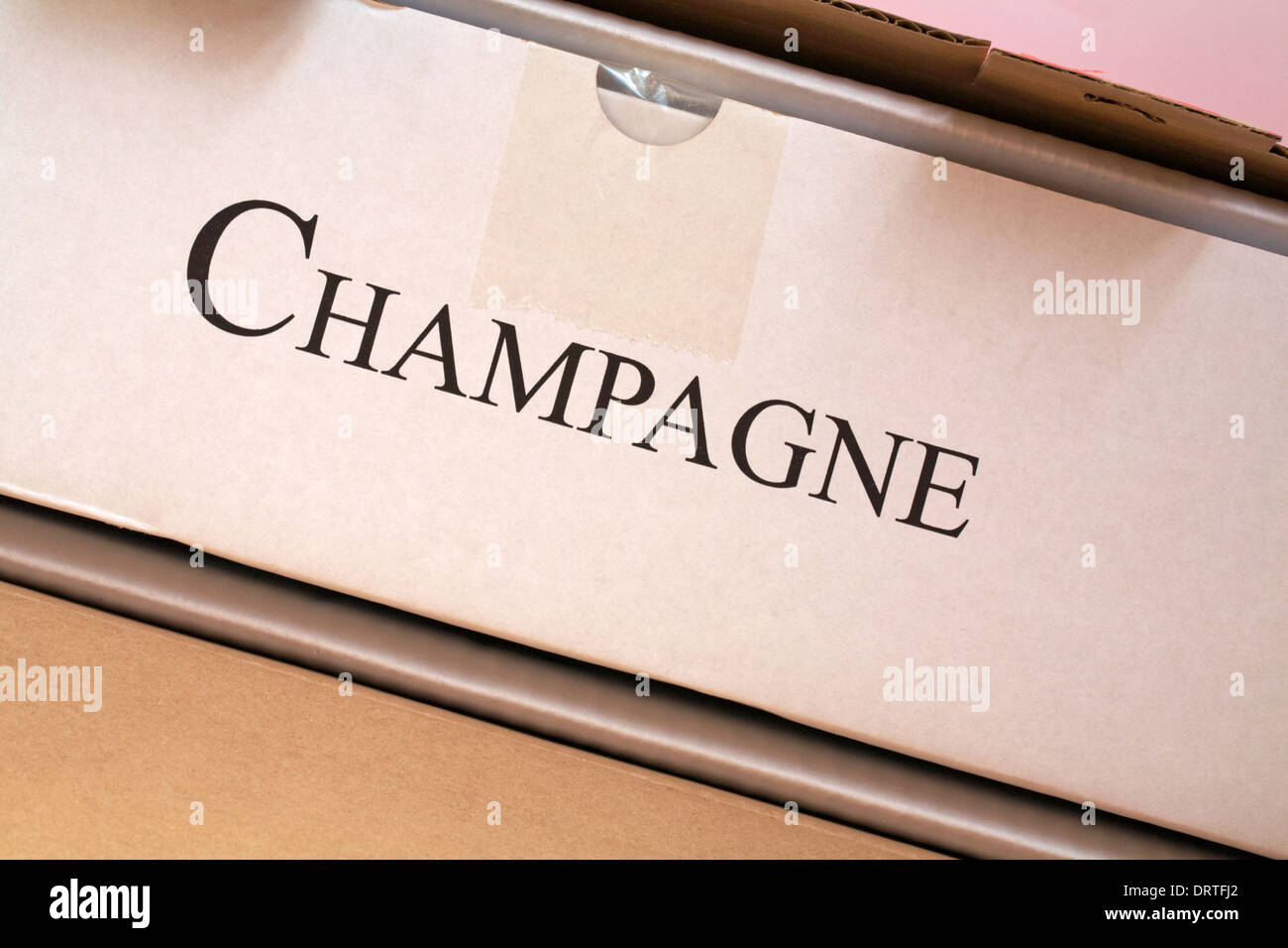 Word champagne on outside of plain white packing box hi-res stock ...