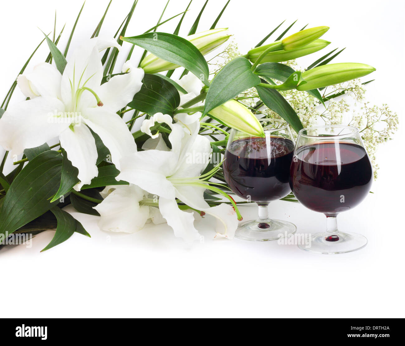 Wine and flowers on white background Stock Photo - Alamy