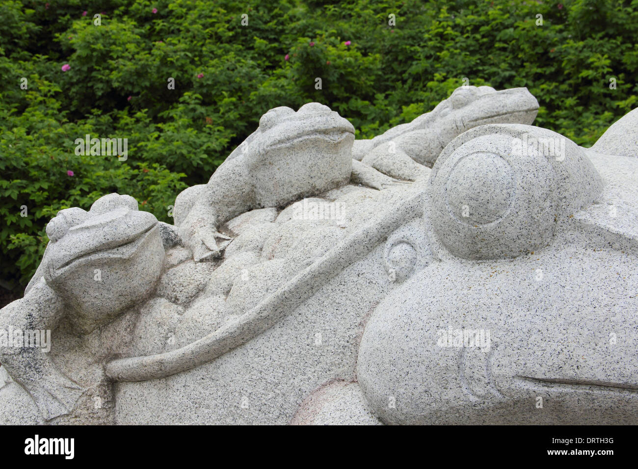 Stone frog sculpture on natural forest background Stock Photo - Alamy