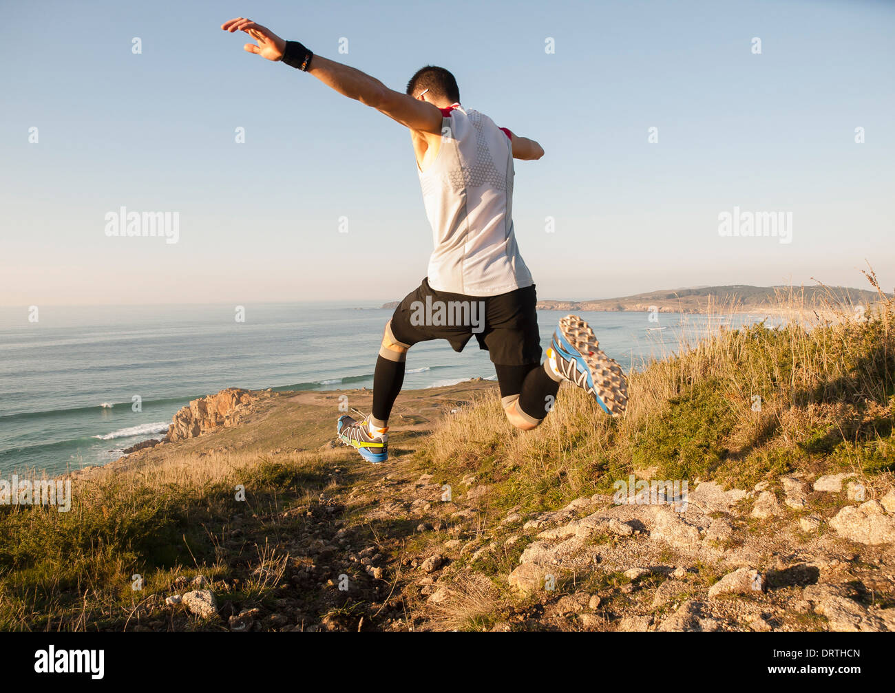 Trail runner in coastal landscape hi-res stock photography and images ...