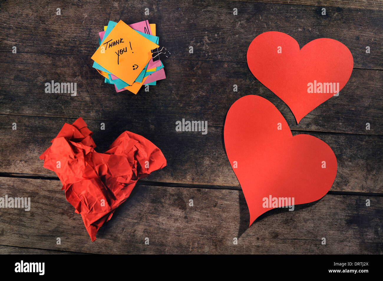 Message of love and appreciation using handmade paper hearts and a pile ...
