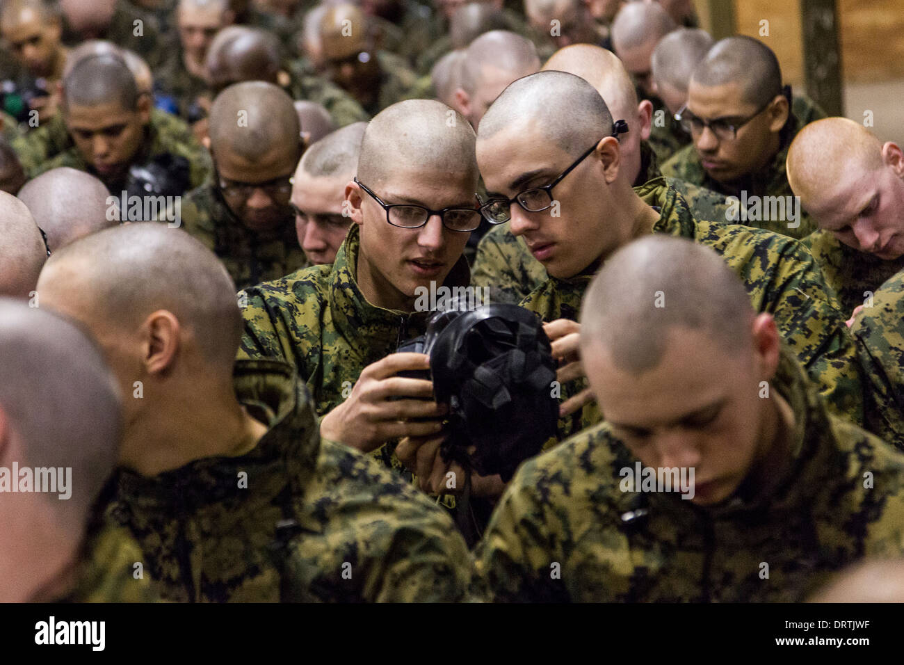 US Marine recruits are trained in proper use of their gas mask during ...