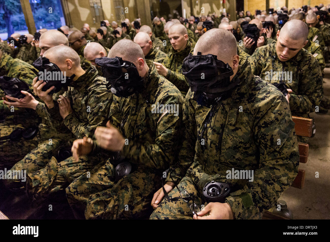 US Marine recruits are trained in proper use of their gas mask during ...