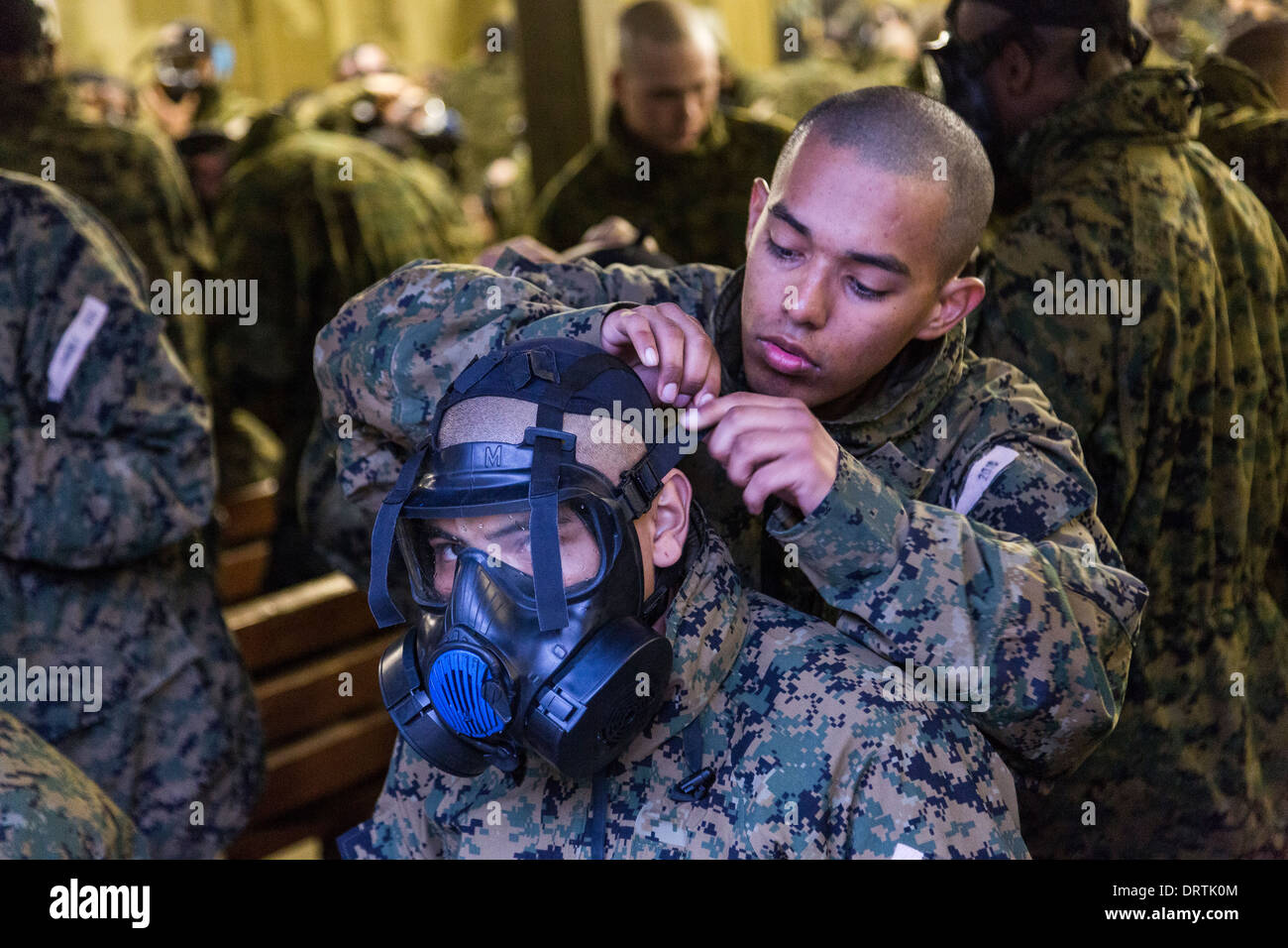 US Marine recruits are trained in proper use of their gas mask during ...