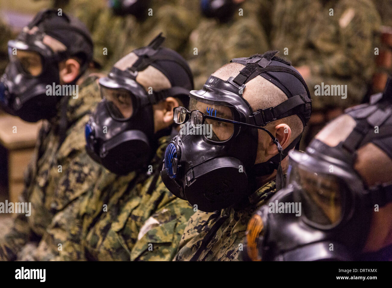 US Marine recruits are trained in proper use of their gas mask during ...