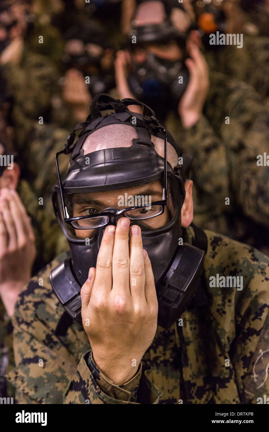 US Marine recruits are trained in proper use of their gas mask during ...