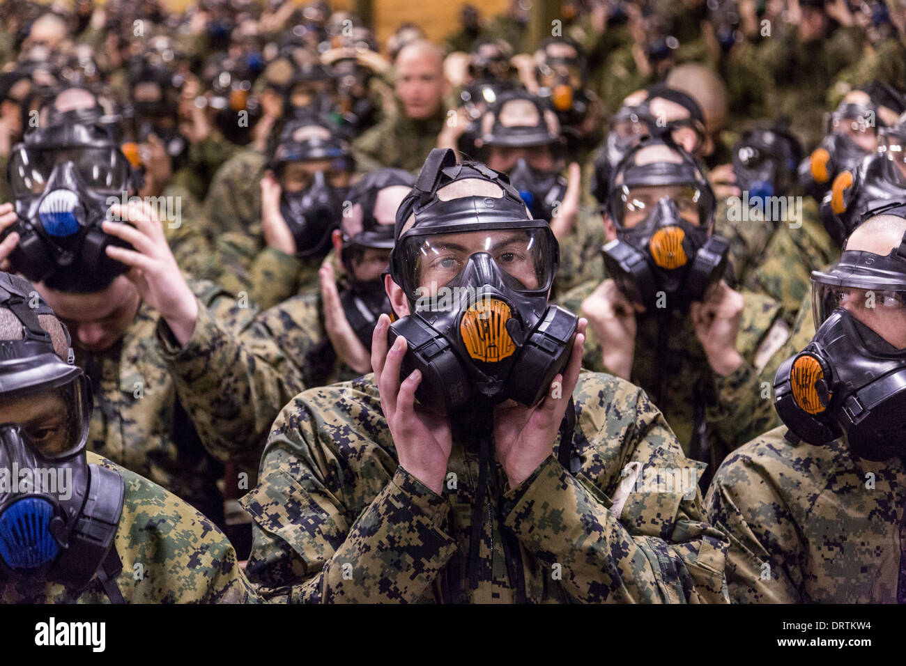 US Marine recruits are trained in proper use of their gas mask during ...