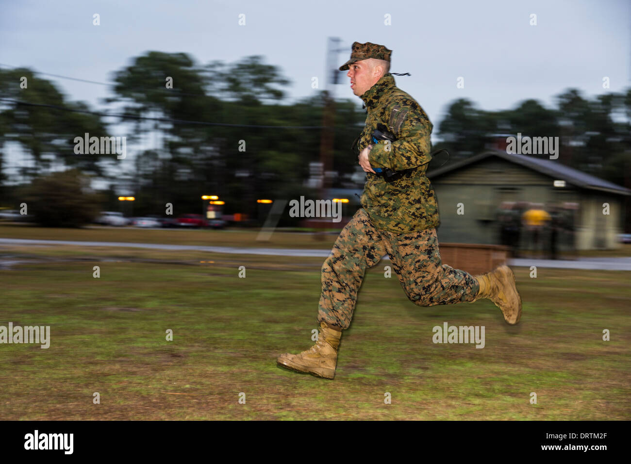 US Marine runs at the command of a drill sergeant during boot camp ...