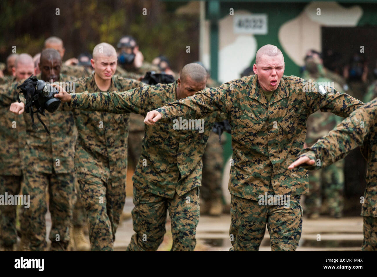 US Marine recruits choke and gasp for air after exiting the gas chamber ...