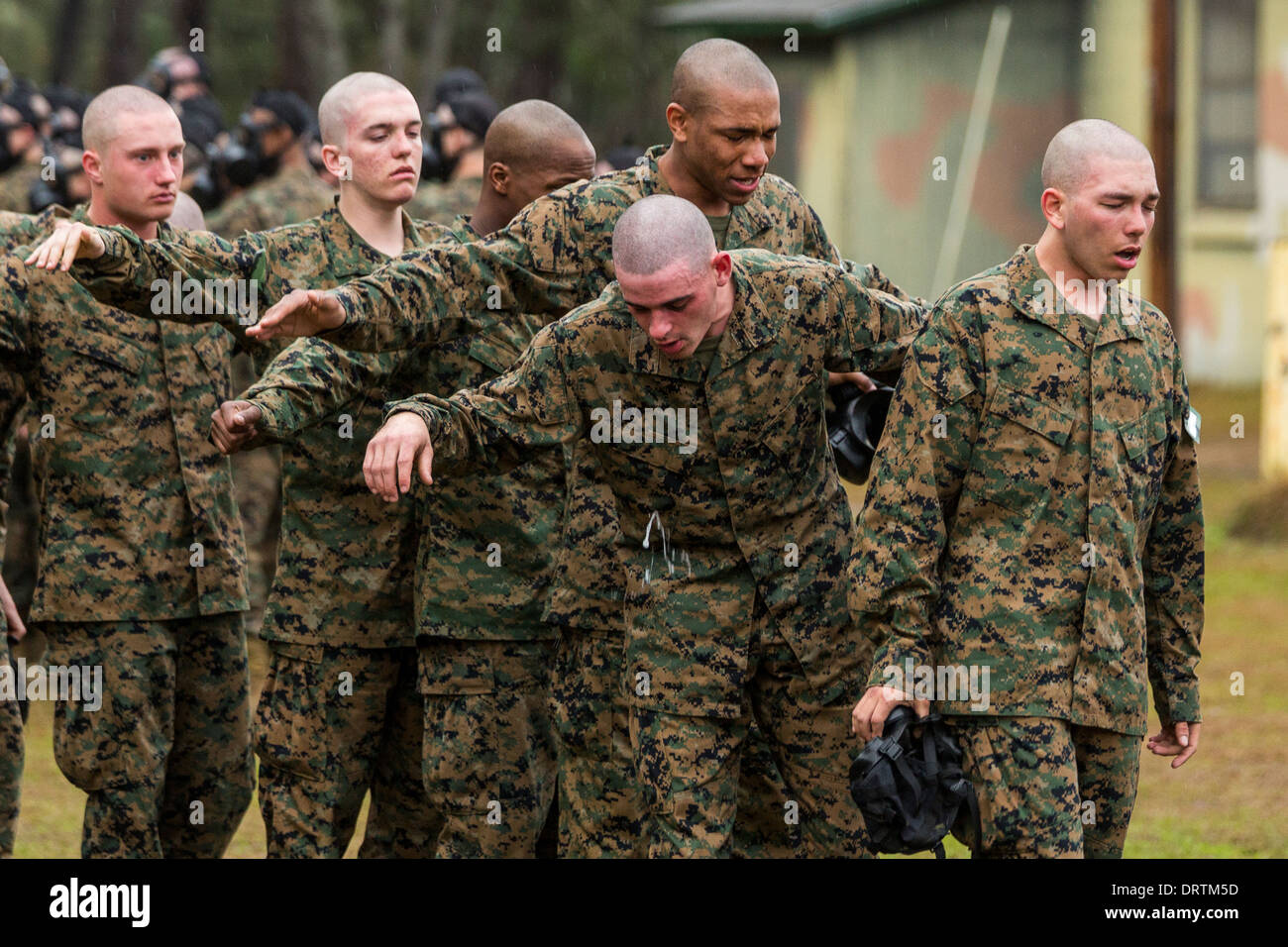US Marine recruits choke and gasp for air after exiting the gas chamber ...