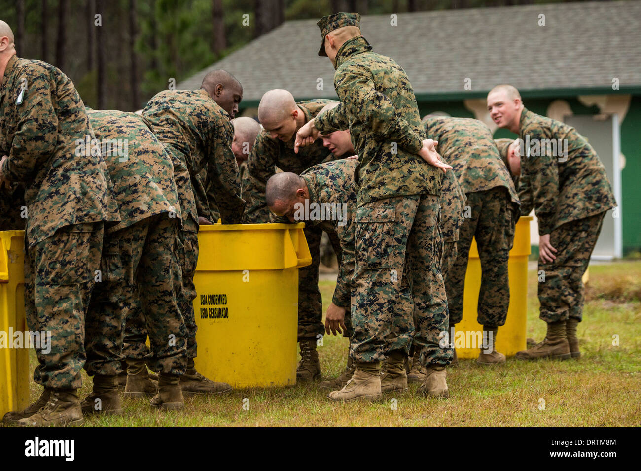 US Marine recruits choke and gasp for air after exiting the gas chamber ...